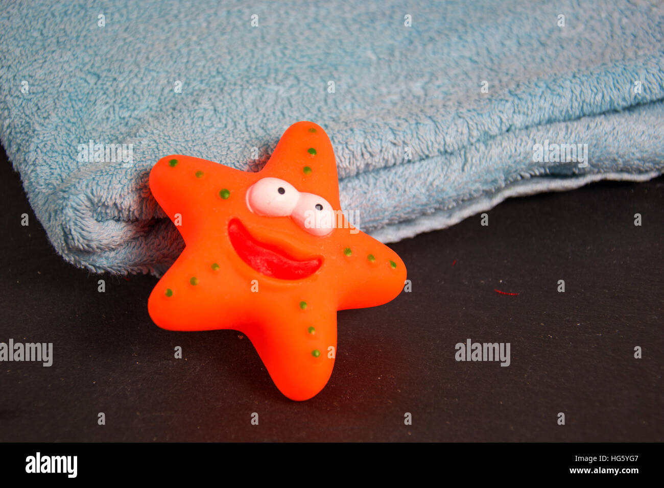 plastic sea star with a towel Stock Photo - Alamy
