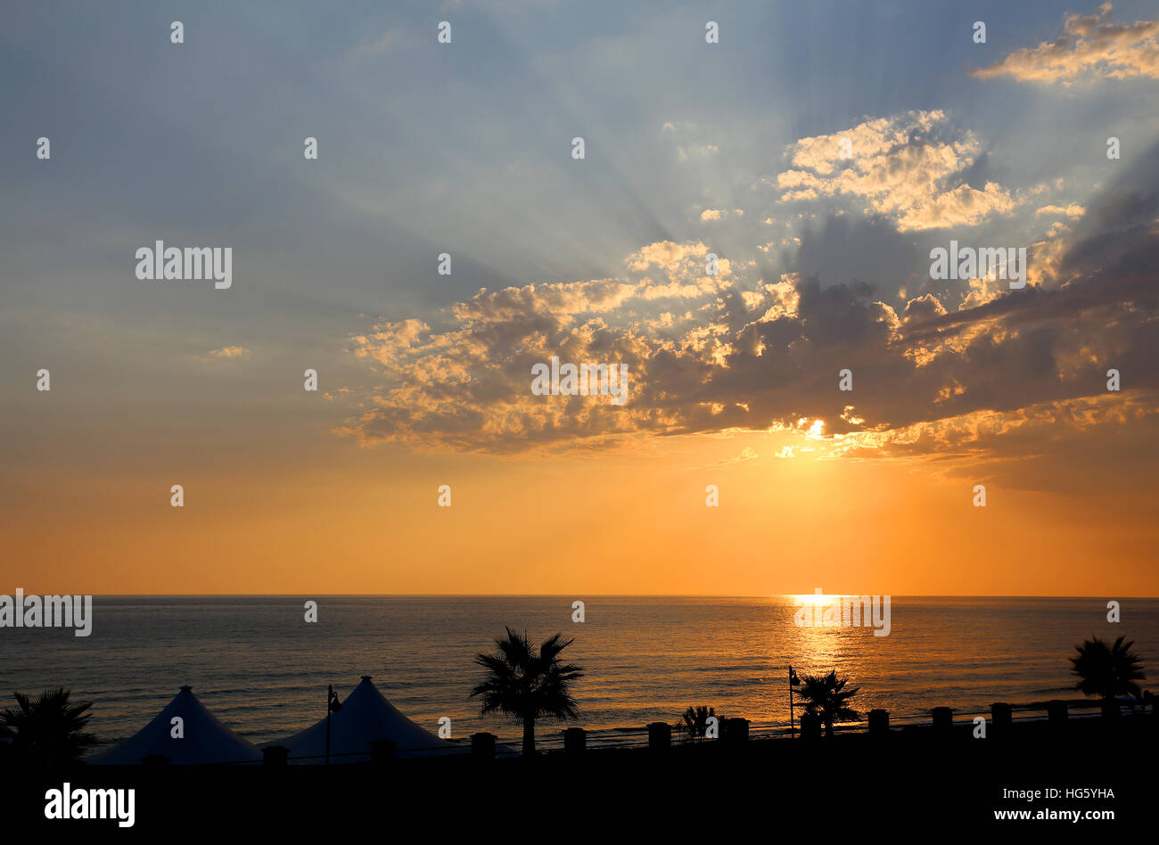 Sunset with light rays on the sea hi-res stock photography and images ...