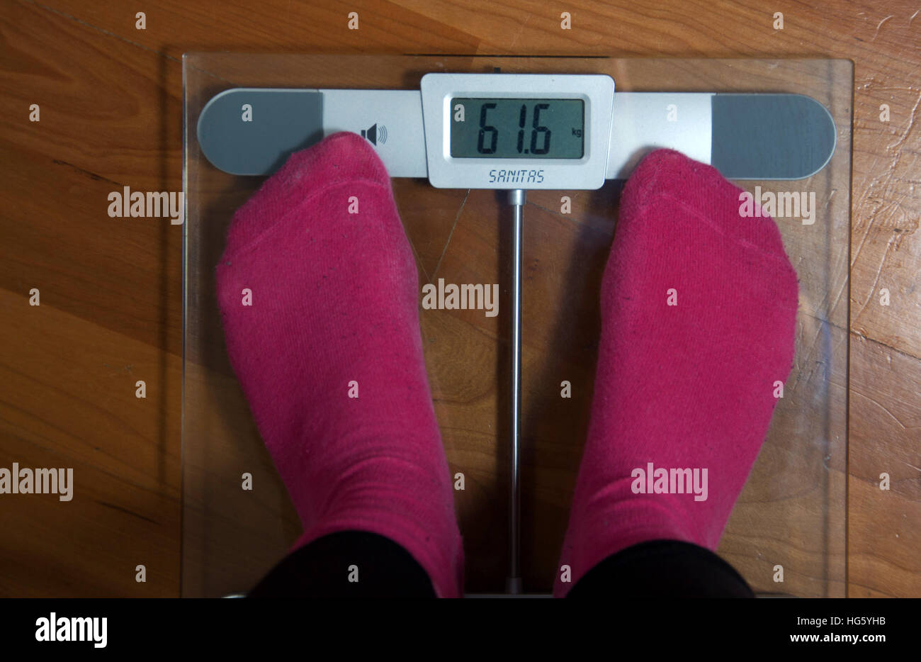 Fat person scales hi-res stock photography and images - Alamy