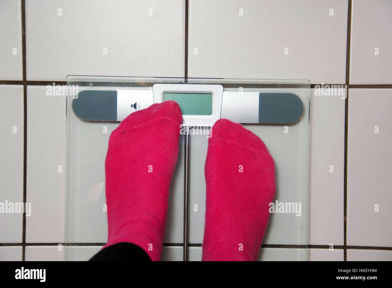 woman on a bathroom scales Stock Photo - Alamy