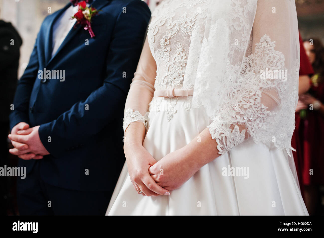 Hands of groom and bride on wedding ceremony at church Stock Photo - Alamy