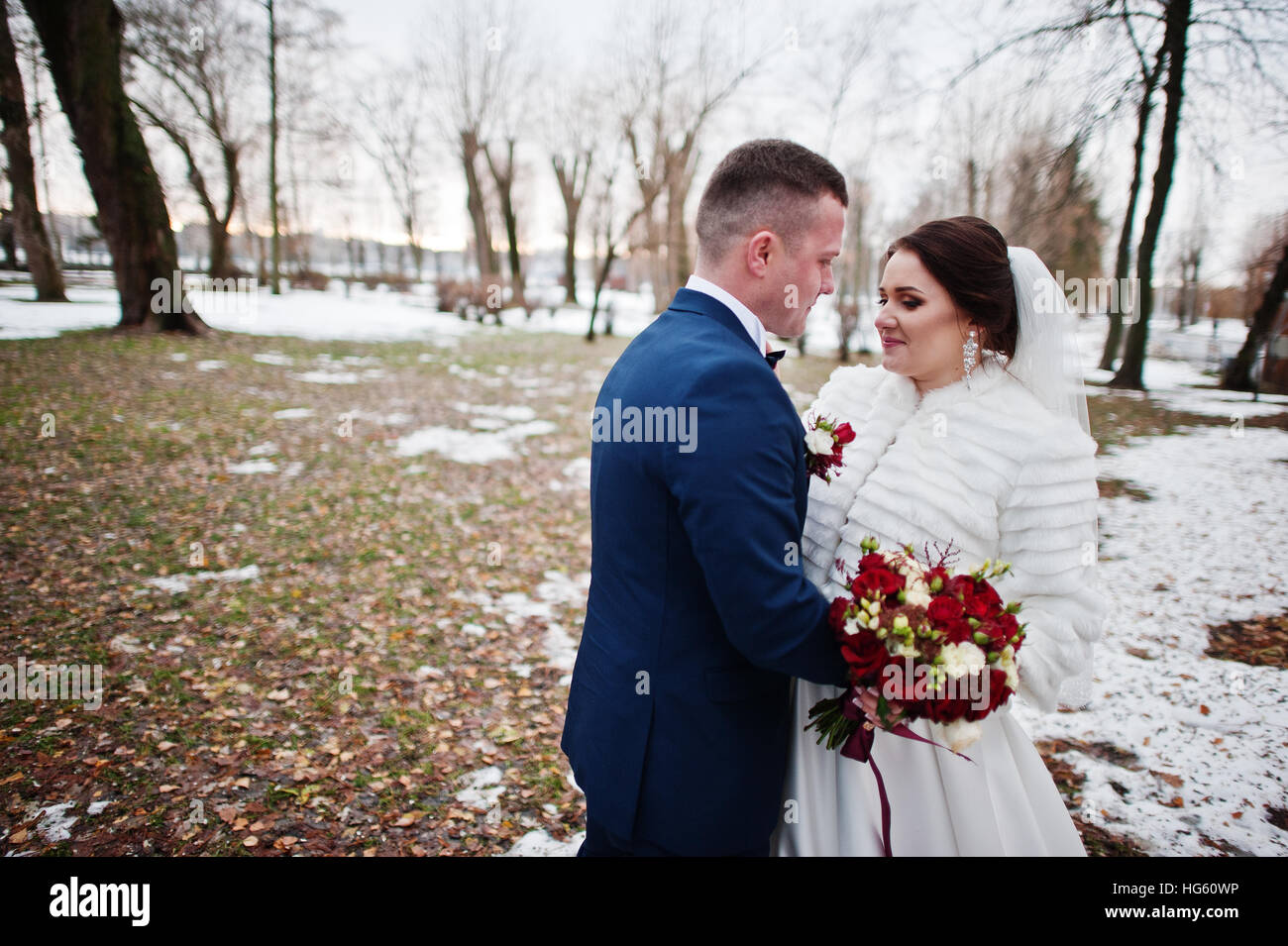 Lovely young wedding couple in love at winter frost day Stock Photo - Alamy