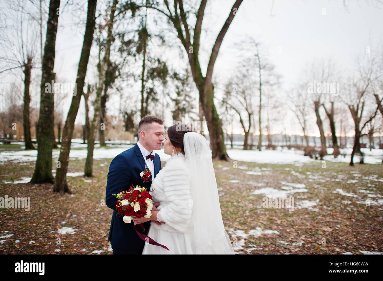 Lovely young wedding couple in love at winter frost day Stock Photo - Alamy