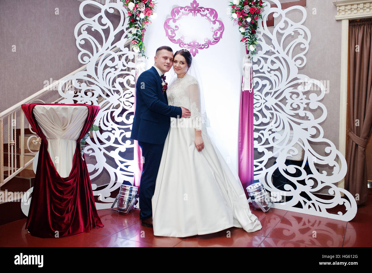 Wedding couple posed background photo zone Stock Photo - Alamy