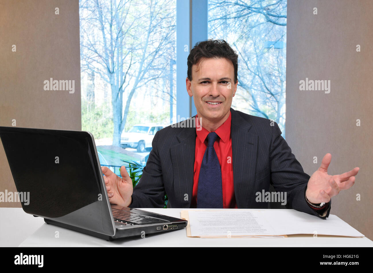 Handsome business man banker or salesman with a computer Stock Photo ...