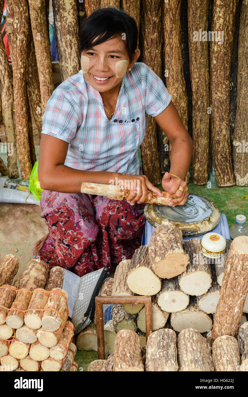 Unidentified burmese woman preparing tanaka, the traditional natural ...