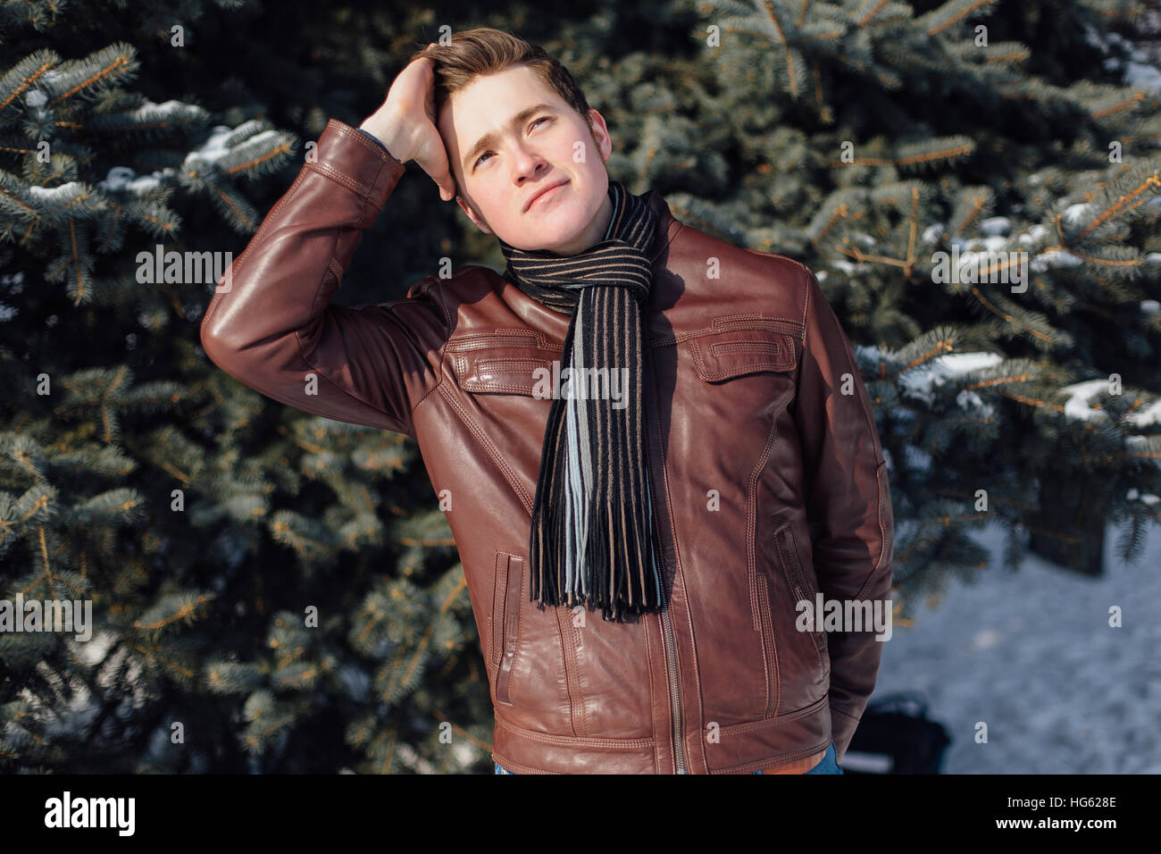 Man's handsome face with style hair in winter sunny day Stock Photo - Alamy
