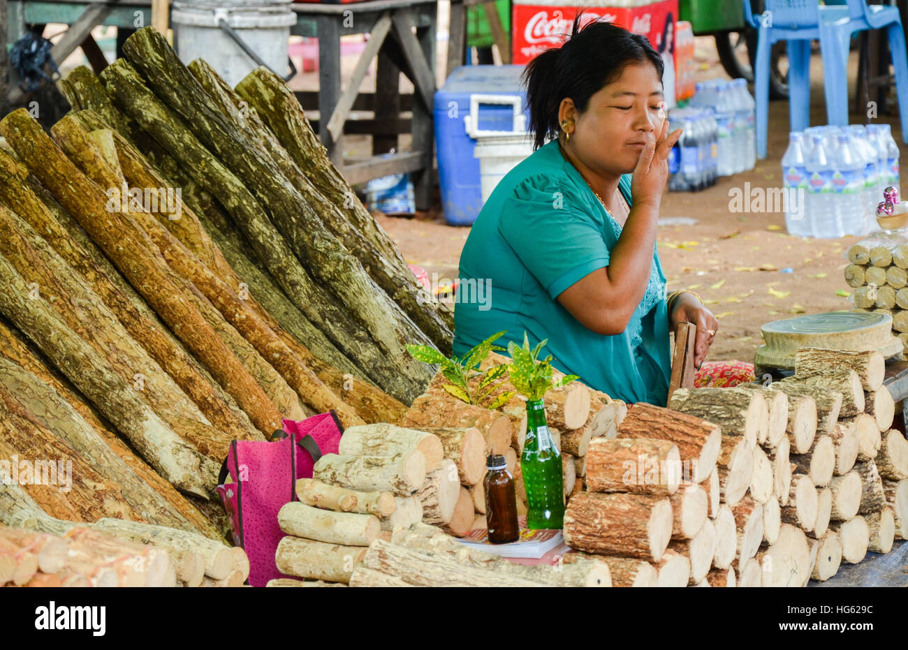 Unidentified burmese woman preparing tanaka, the traditional natural ...