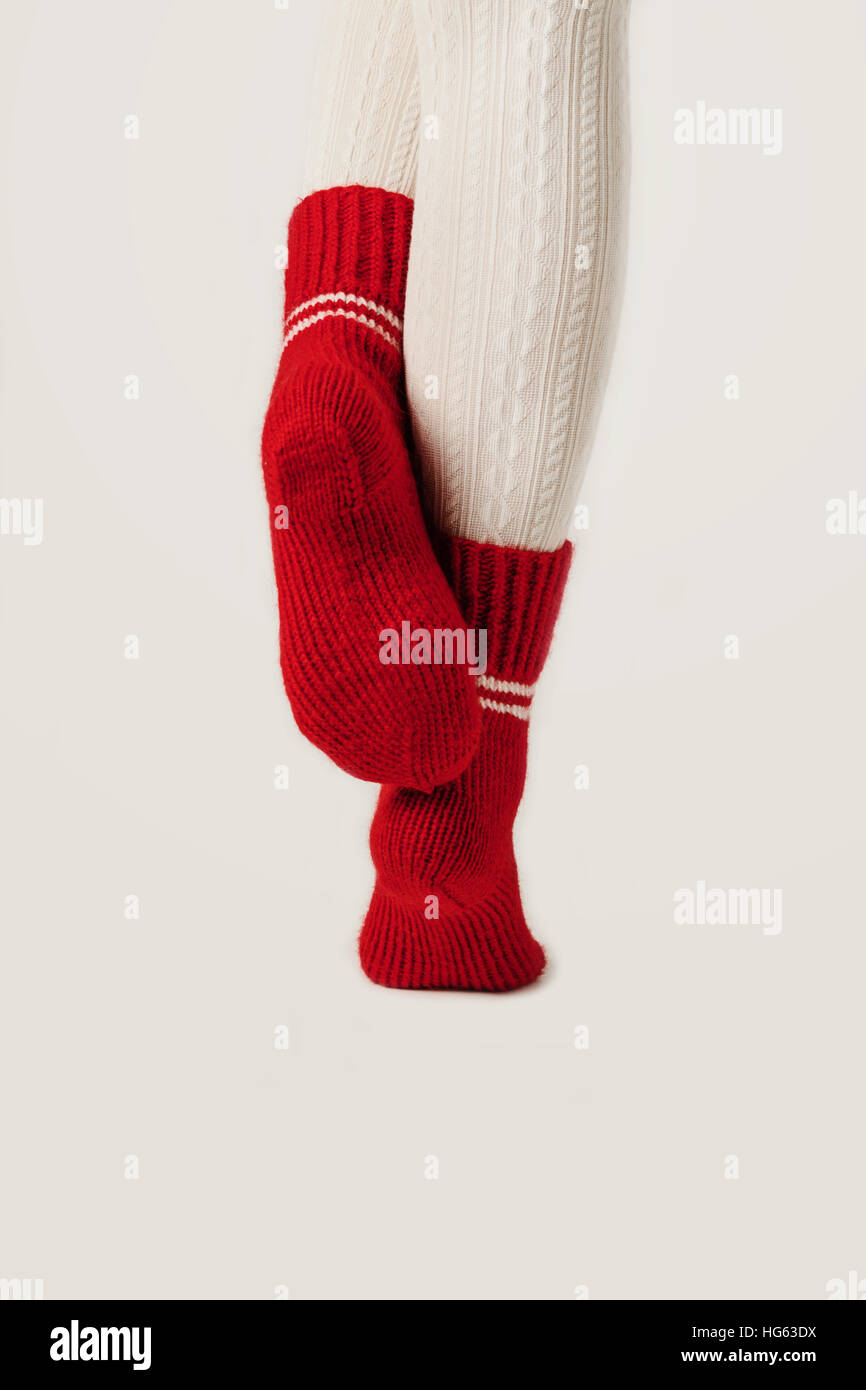 Female legs in white stockings and red knit socks Stock Photo - Alamy