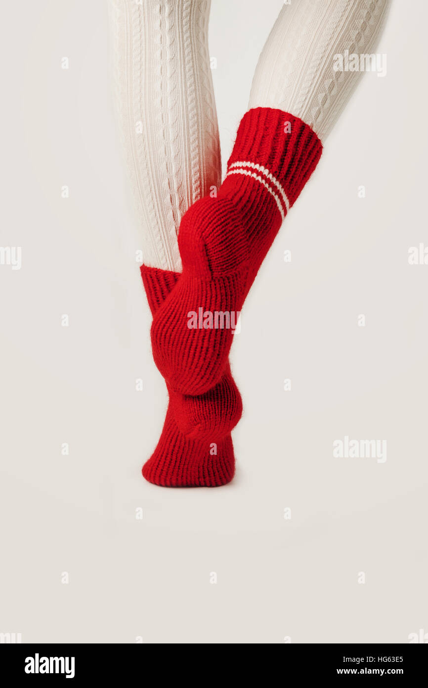 Female legs in white stockings and red knit socks Stock Photo - Alamy