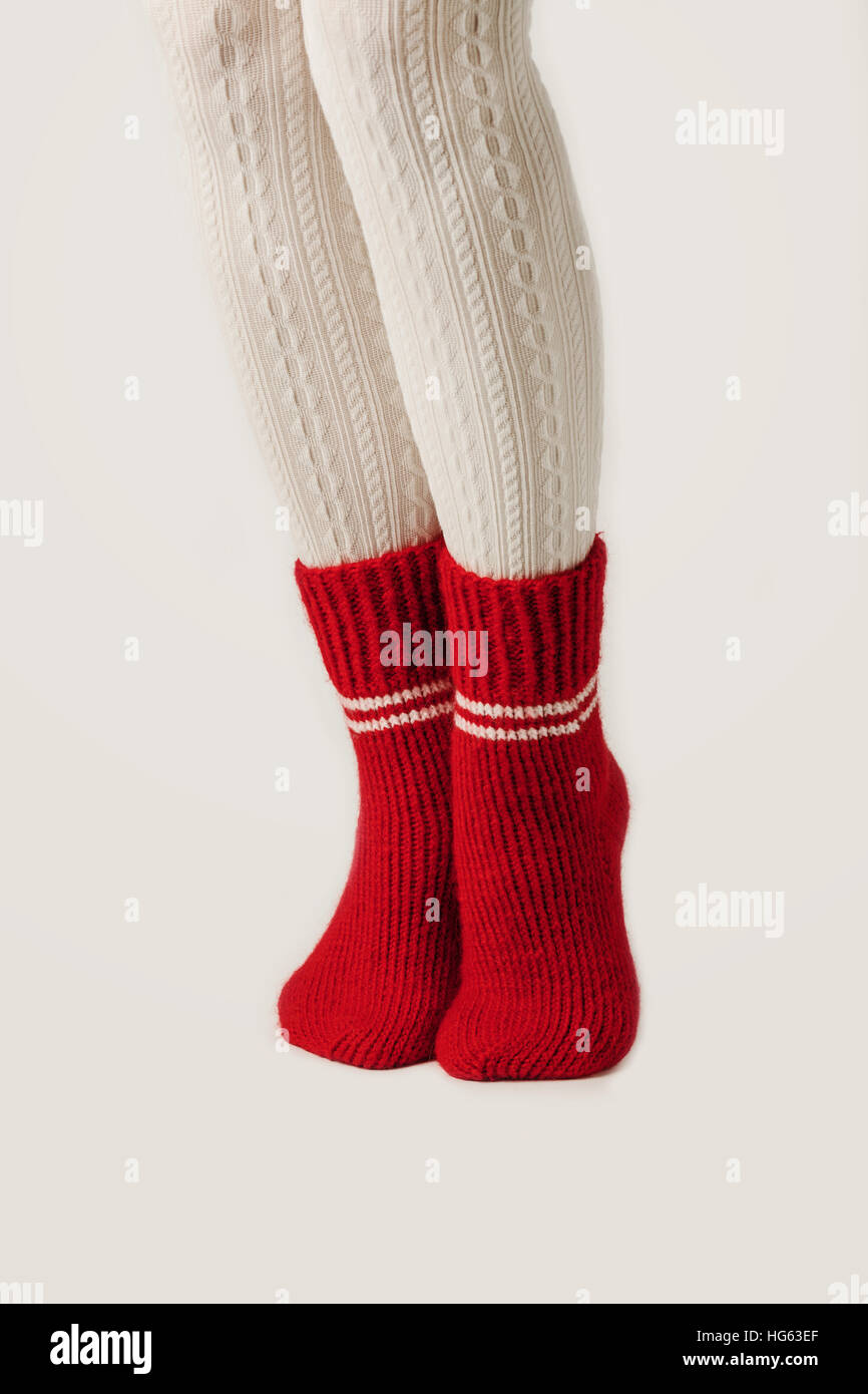 Female legs in white stockings and red knit socks Stock Photo - Alamy