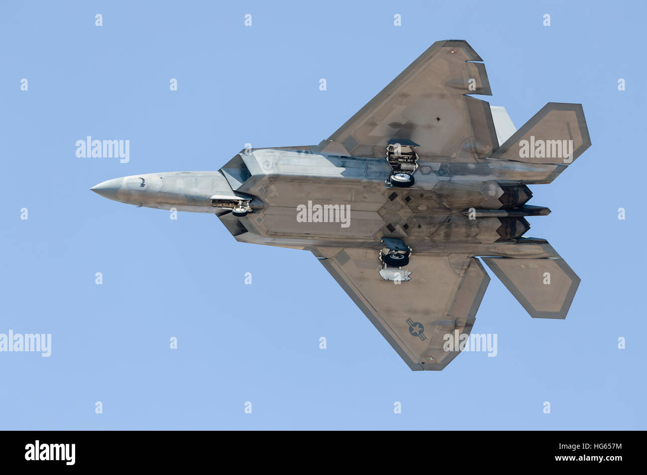 A U.S. Air Force F-22 Raptor on final approach to Nellis Air Force Base ...