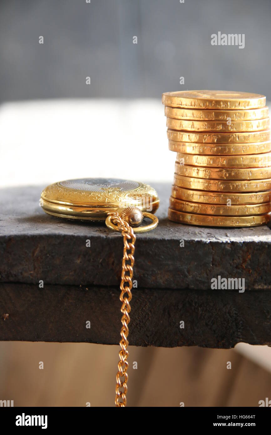 Gold watch chain coins hi-res stock photography and images - Alamy