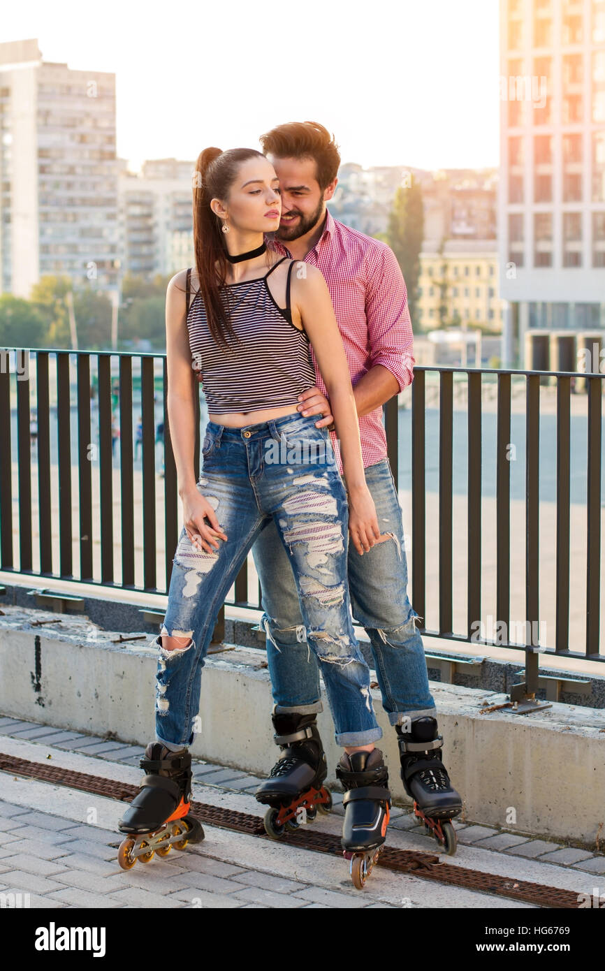 Young couple on inline skates Stock Photo - Alamy