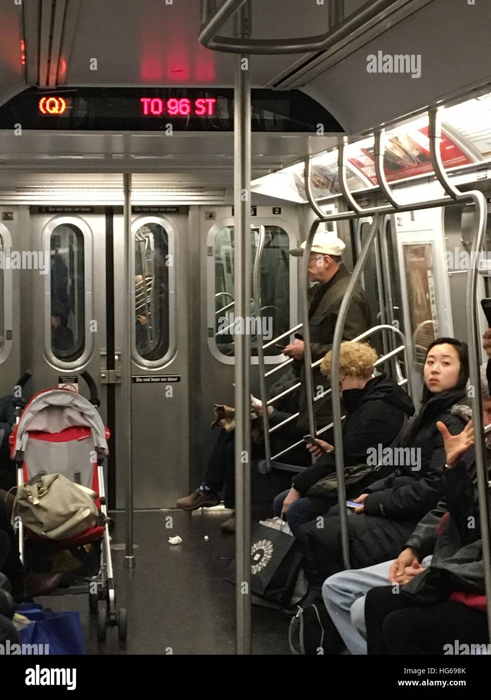 New York, NY, USA. 1st Jan, 2017. Passengers on the Q subway train on ...