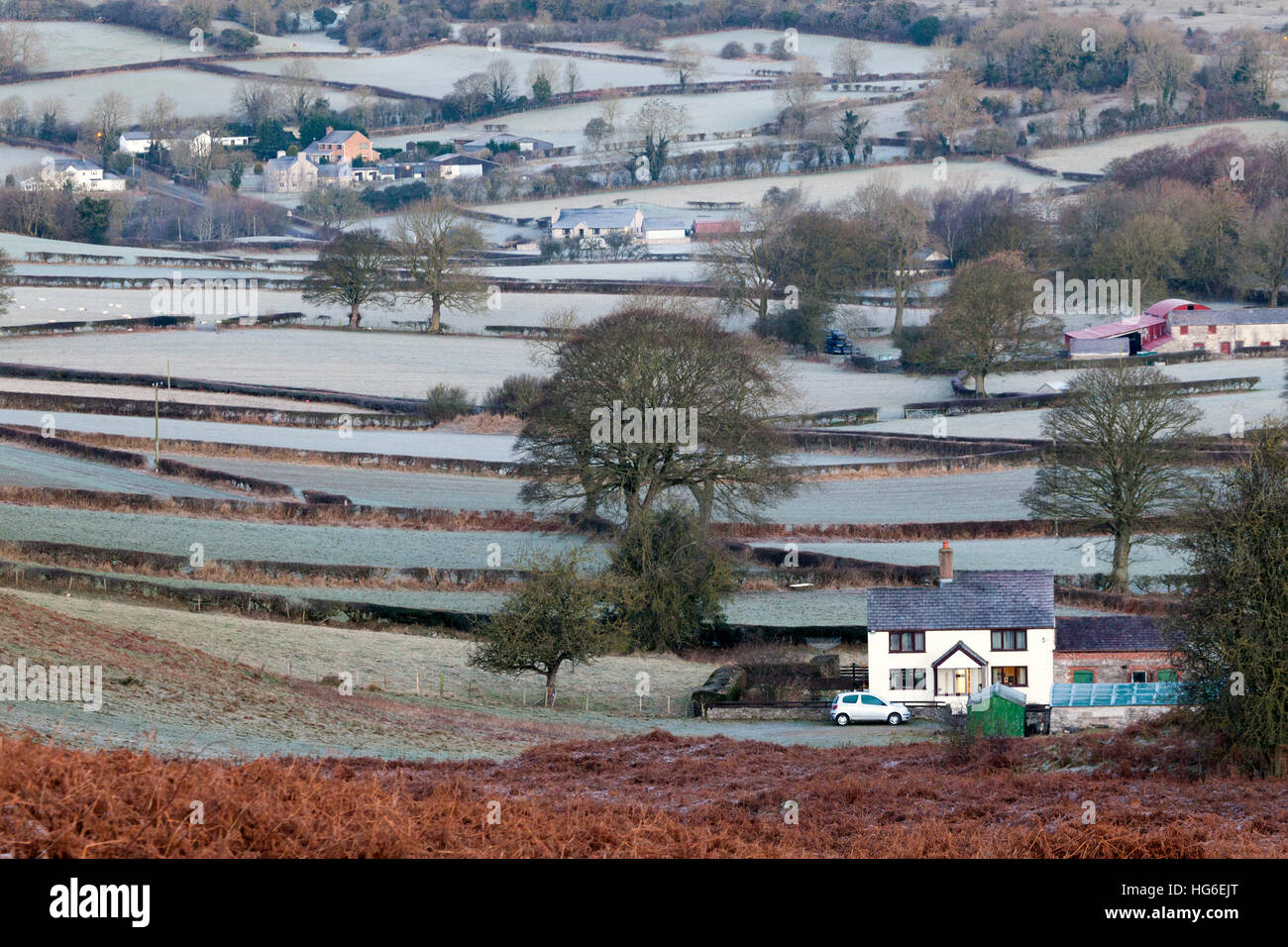 A farm cottage surround by a frozen landscape in the village of Rhes-y ...