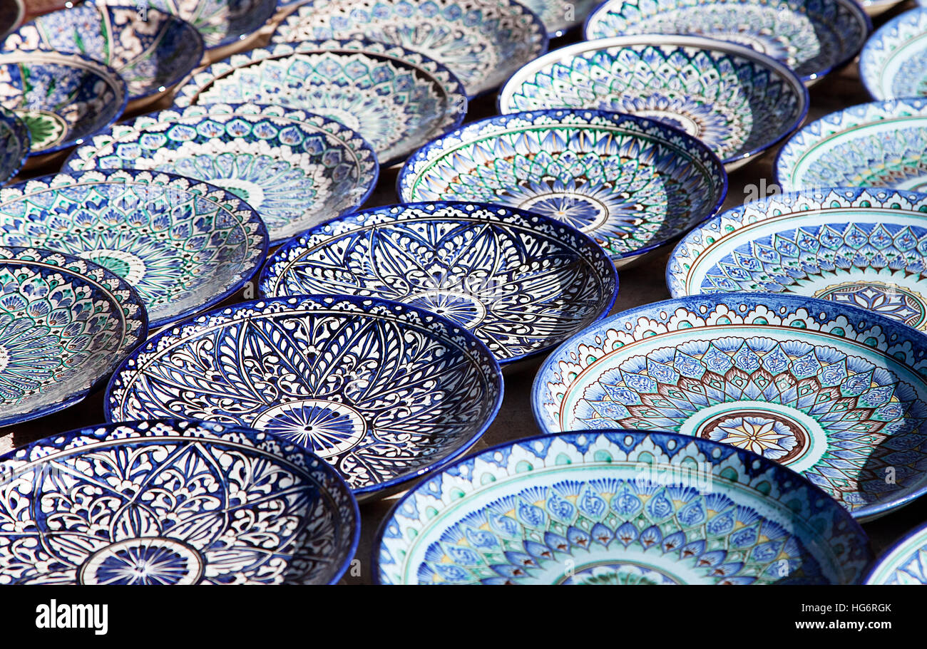 Traditional ceramic dishware in a street market, Uzbekistan Stock Photo ...
