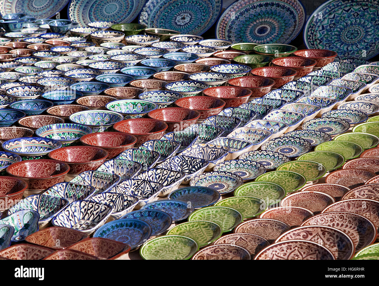 Traditional ceramic dishware in a street market, Uzbekistan Stock Photo ...