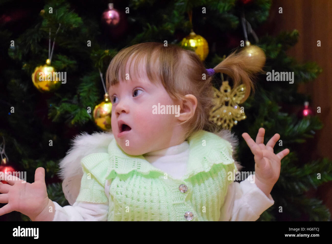 Surprised girl. Child Mimicry. Girl throws up his hands. One year old ...