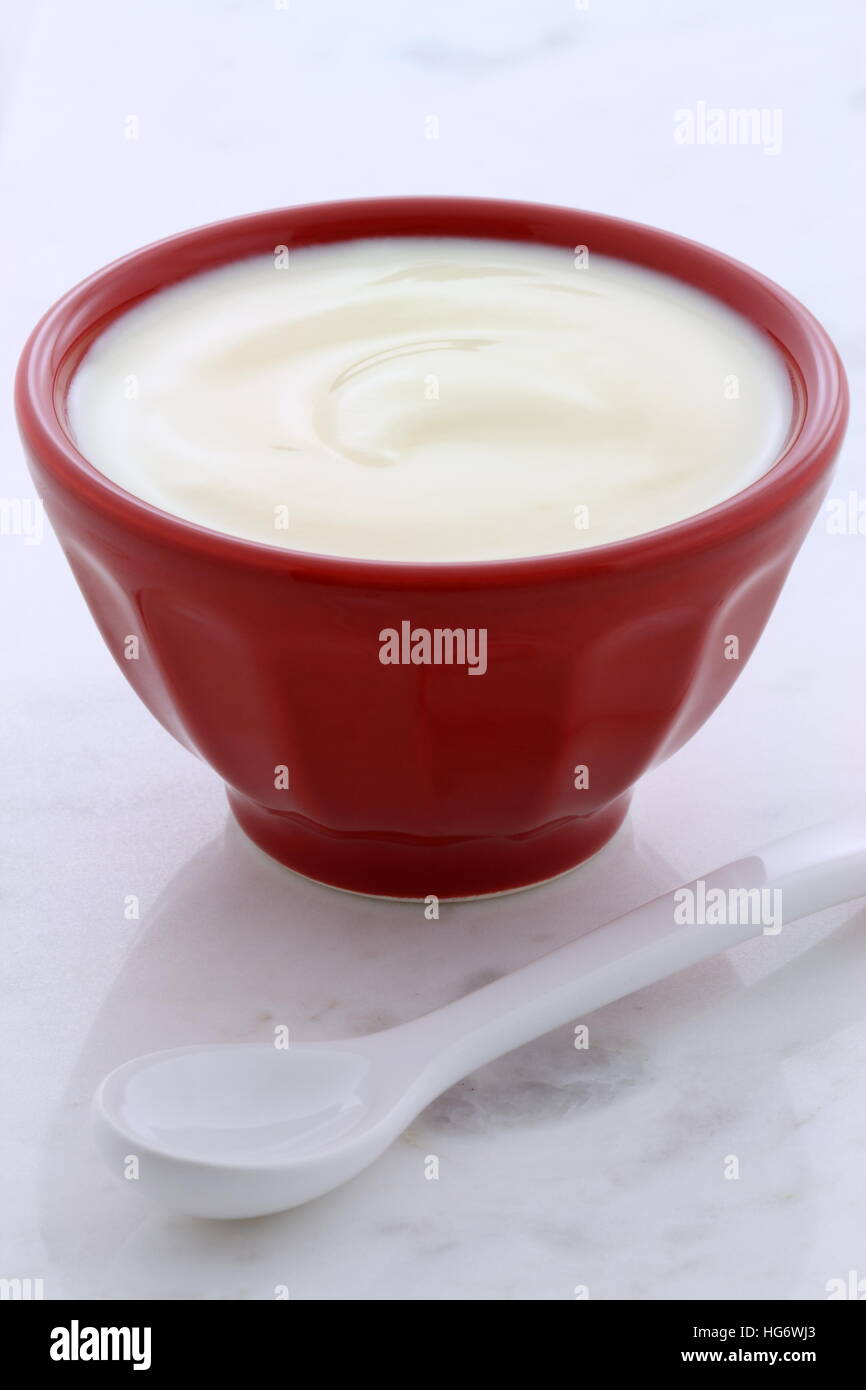 Delicious, nutritious and healthy fresh plain yogurt on carrara marble ...
