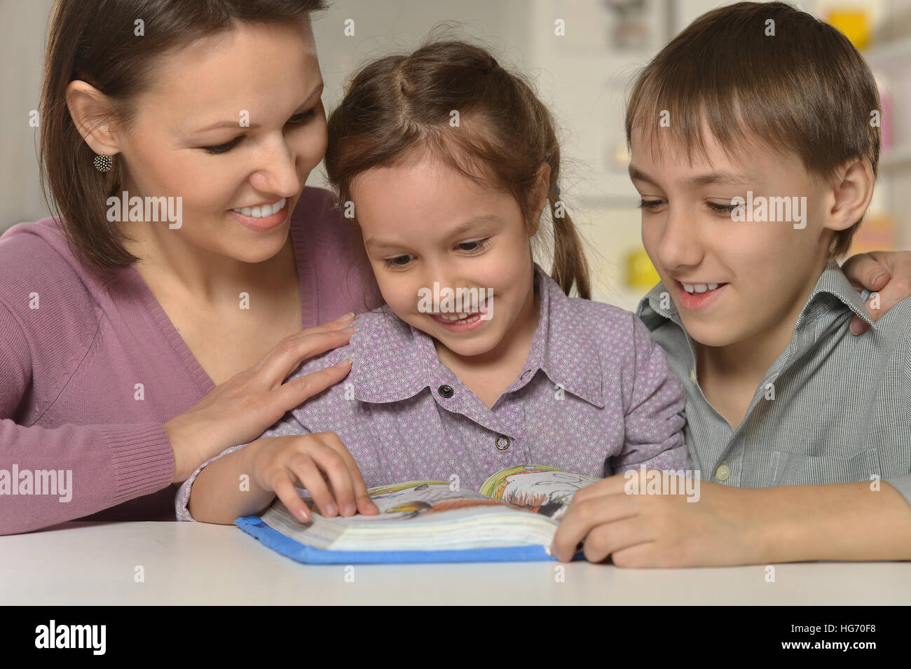 mother learning lessons with kids Stock Photo - Alamy