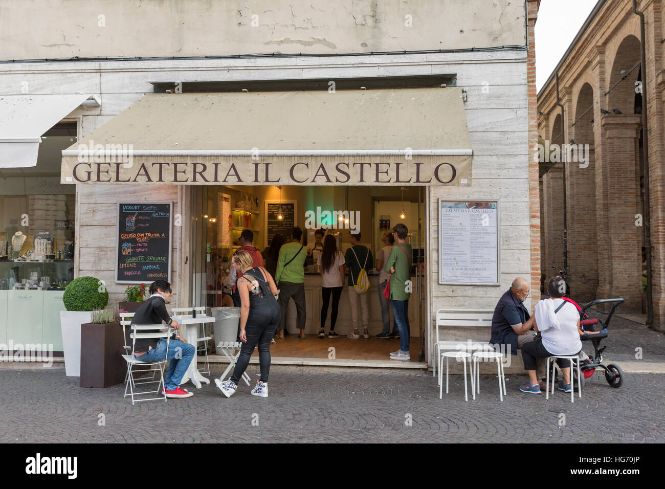 People visit ice cream shop Il Castello on Cavour Square. Rimini is one ...