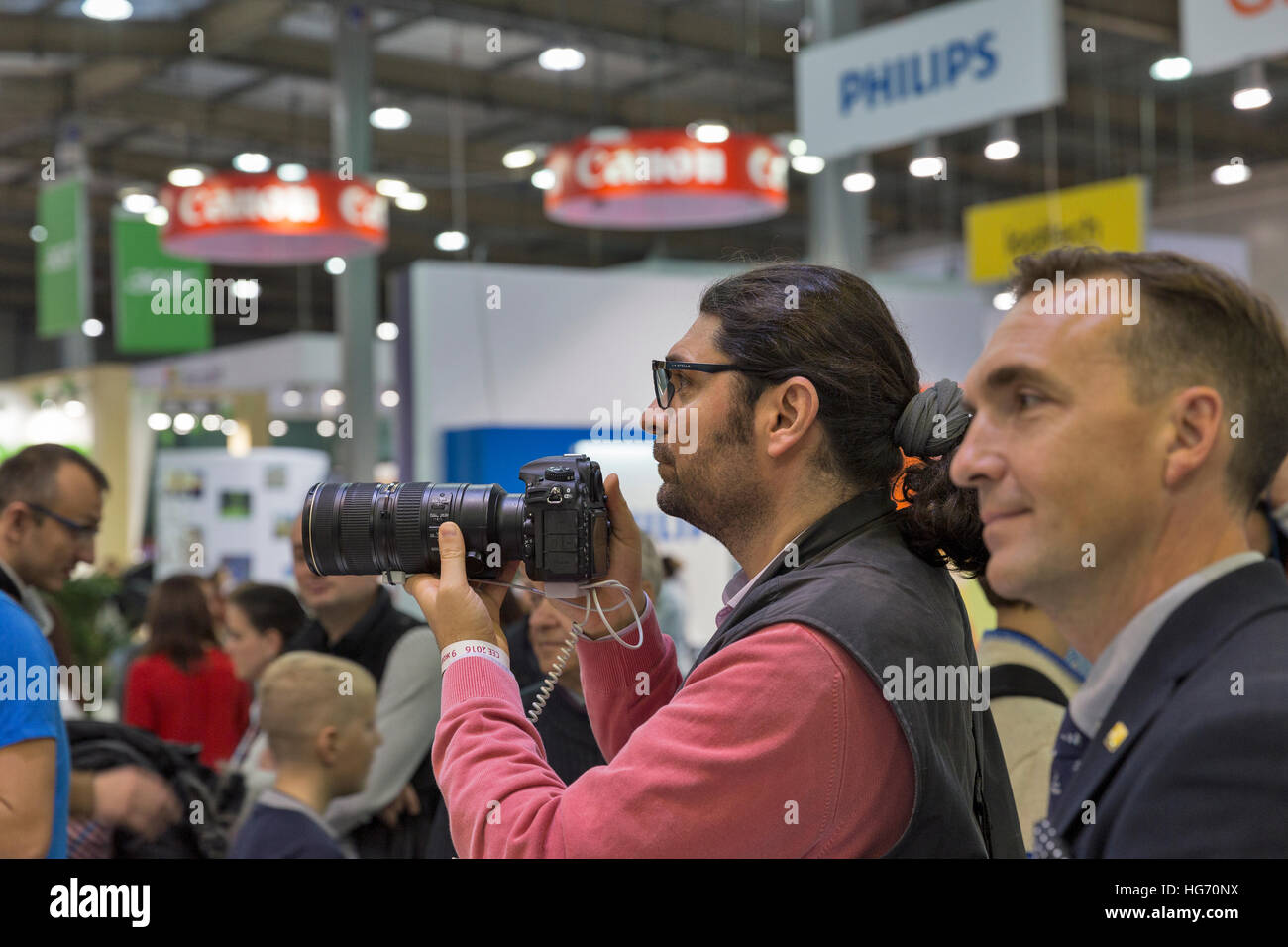 Unrecognized visitors testing professional photographic cameras on ...