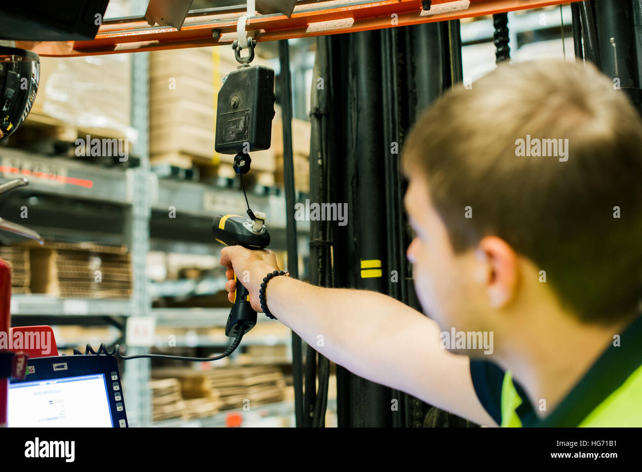 man driver Reachtruck busy working logistics warehouse store Stock ...