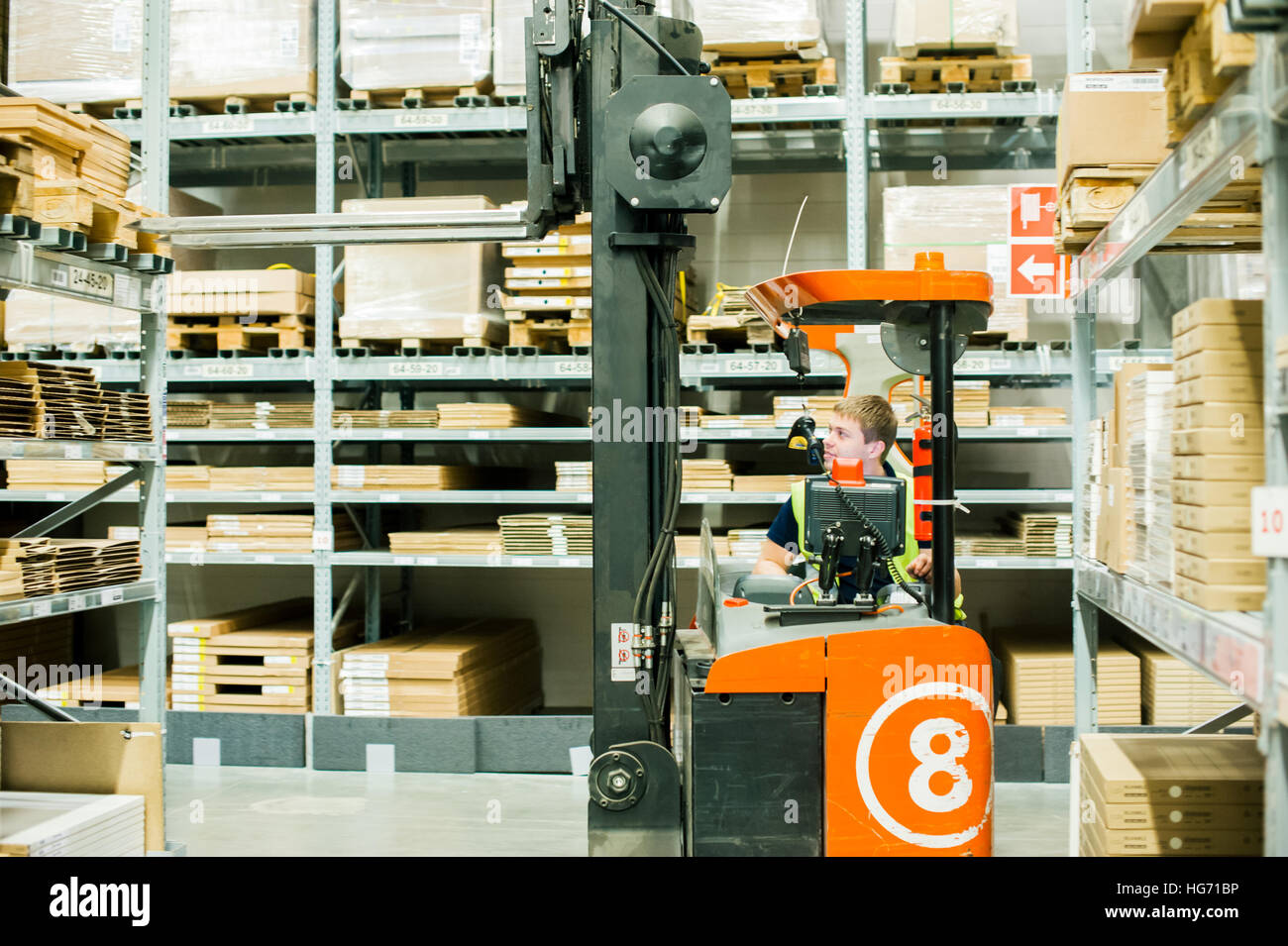 man driver Reachtruck busy working logistics warehouse store Stock ...