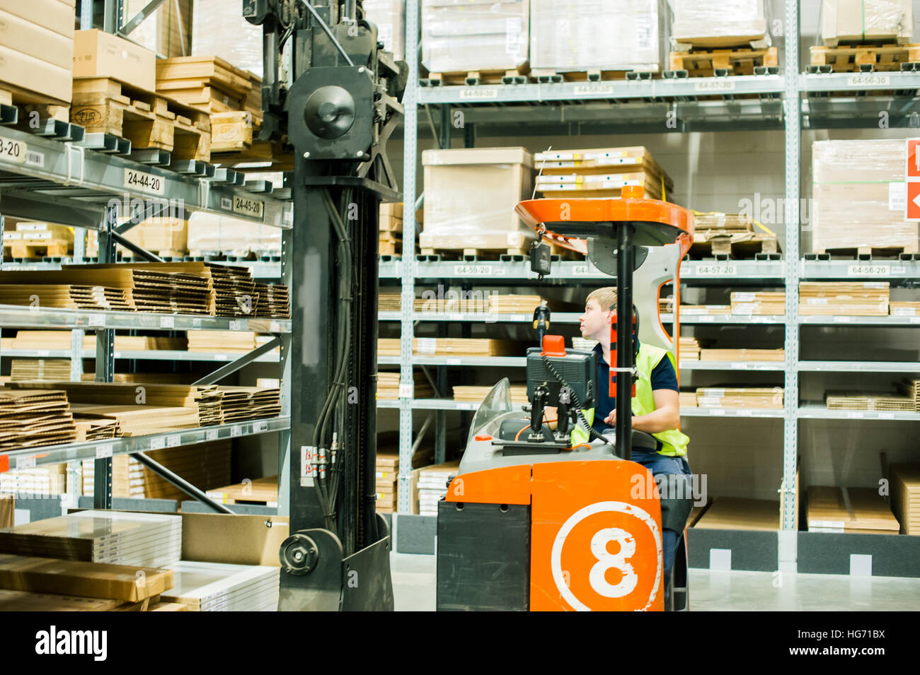 man driver Reachtruck busy working logistics warehouse store Stock ...