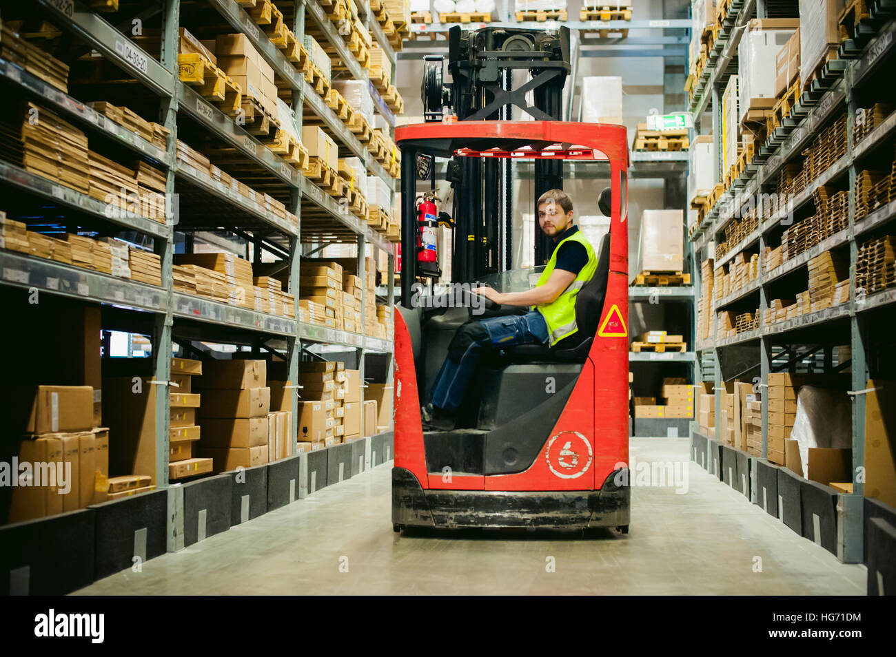 man driver Reachtruck busy working logistics warehouse store Stock ...