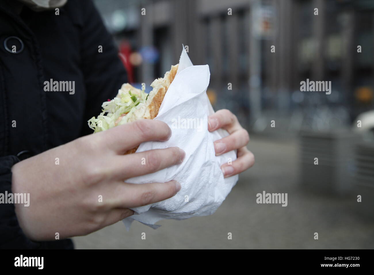 Woman eating a Doner Kebab in Berlin Stock Photo - Alamy