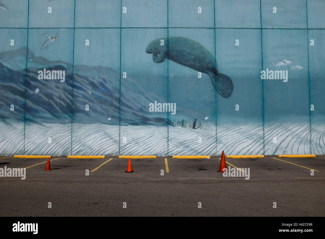NEW ORLEANS, LA: A parking lot mural depicts an ocean scene with a ...