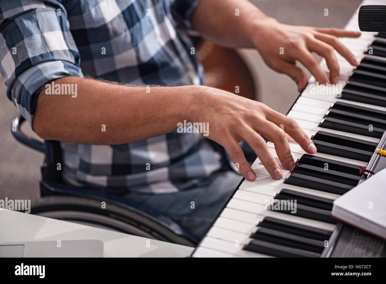 Creative disabled person playing piano Stock Photo - Alamy