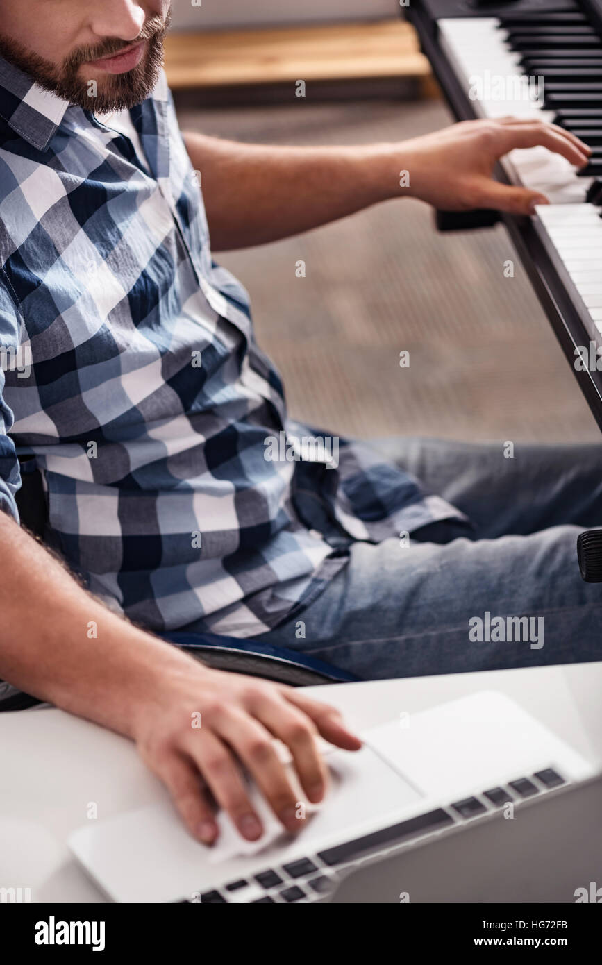 Committed young man mixing new tracks Stock Photo - Alamy