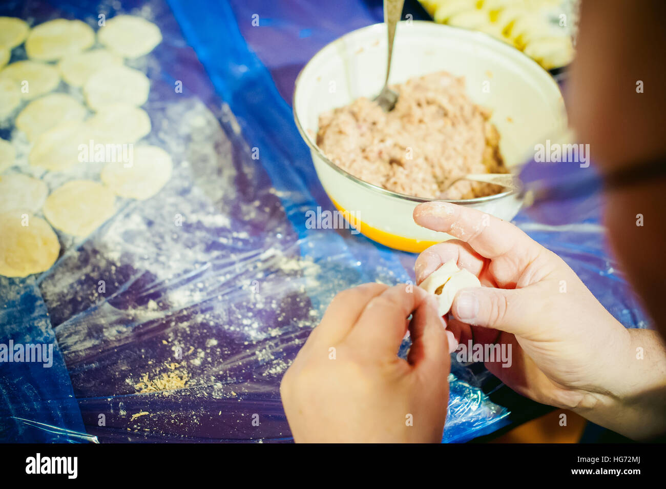 hand modeling dumplings at home in the kitchen Stock Photo - Alamy