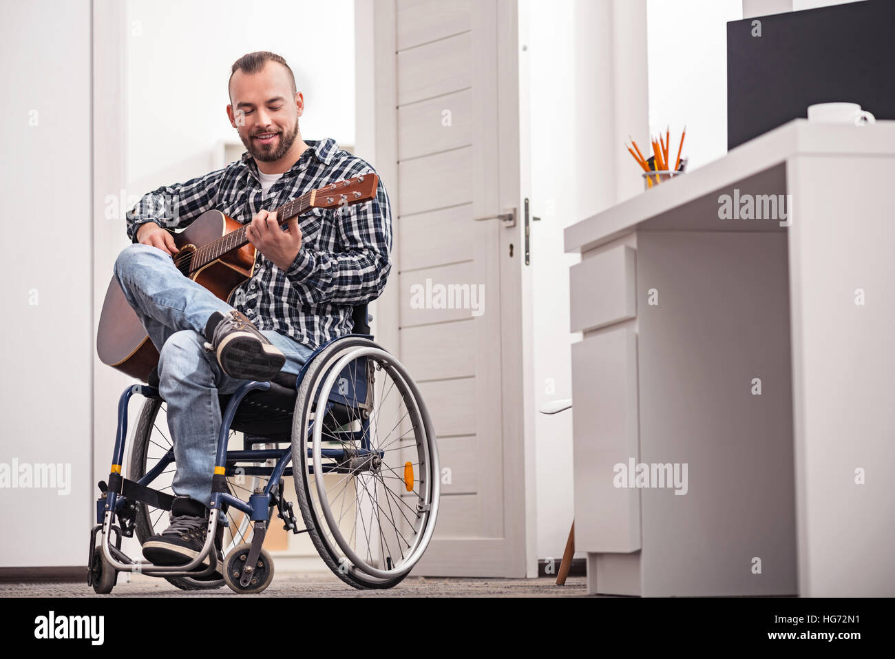 Inspired disabled man singing a song Stock Photo - Alamy