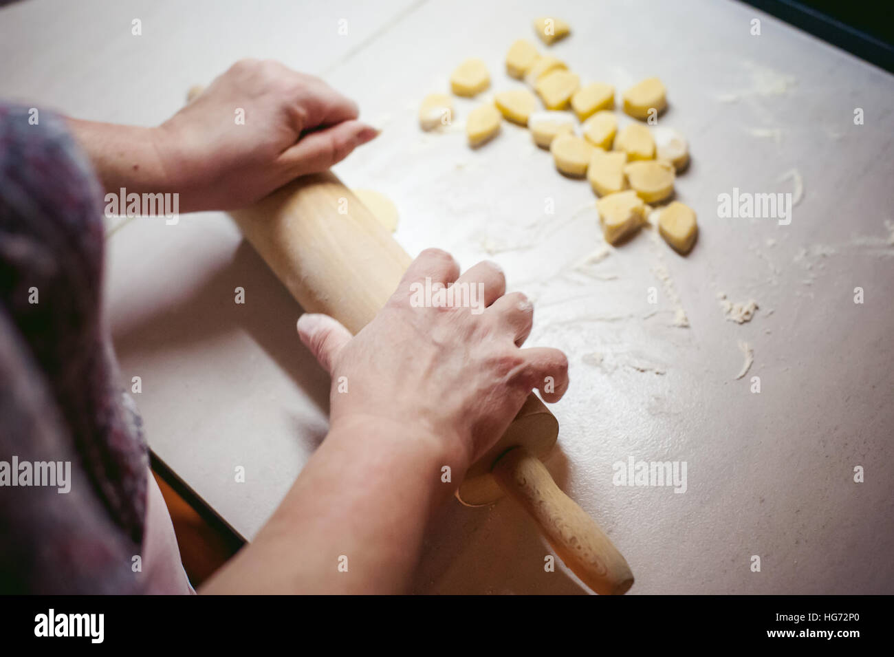 hand modeling dumplings at home in the kitchen. pelmeni lay on a baking ...