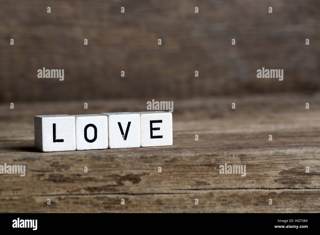 Love, written in cubes on wooden background Stock Photo - Alamy