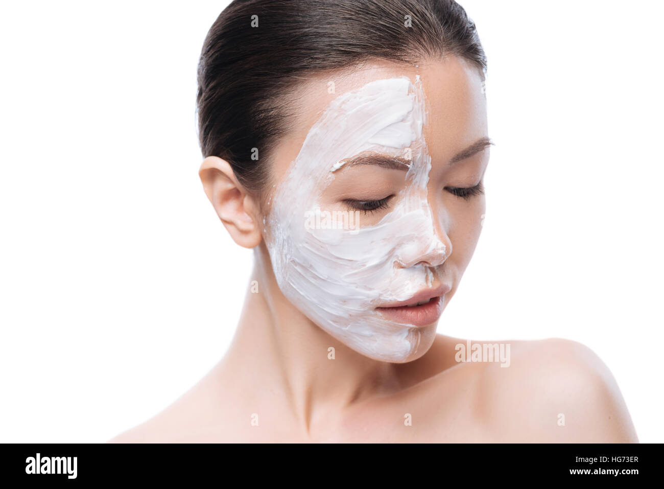 Charming pleasant woman using moisturizing cream Stock Photo - Alamy