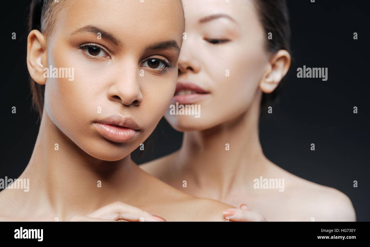 Beautiful young woman looking at you Stock Photo - Alamy