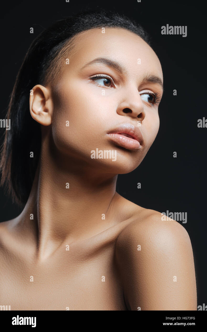 Cute nice woman craning her neck Stock Photo - Alamy