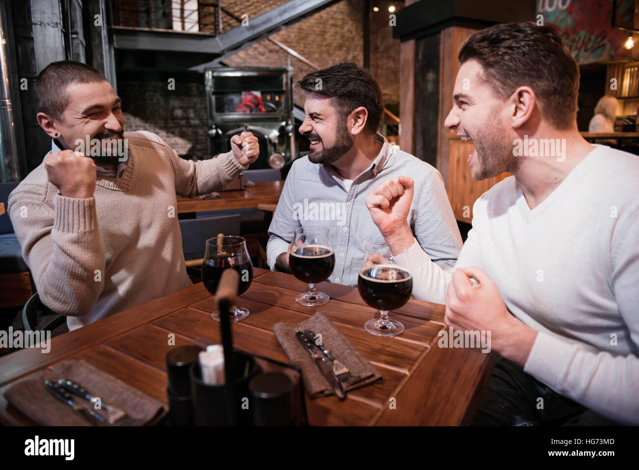 Positive delighted men expressing their emotions Stock Photo - Alamy