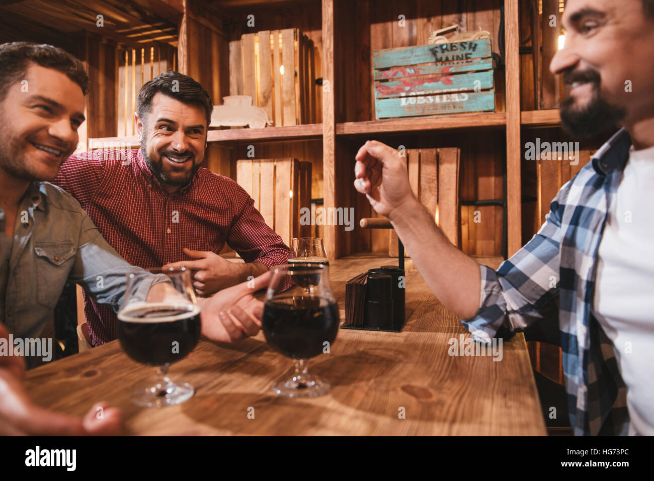Nice happy men talking with each other Stock Photo - Alamy