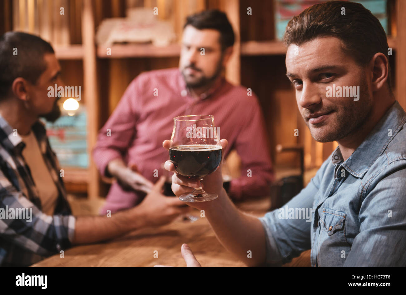 Handsome attractive man having alcoholic drink Stock Photo - Alamy