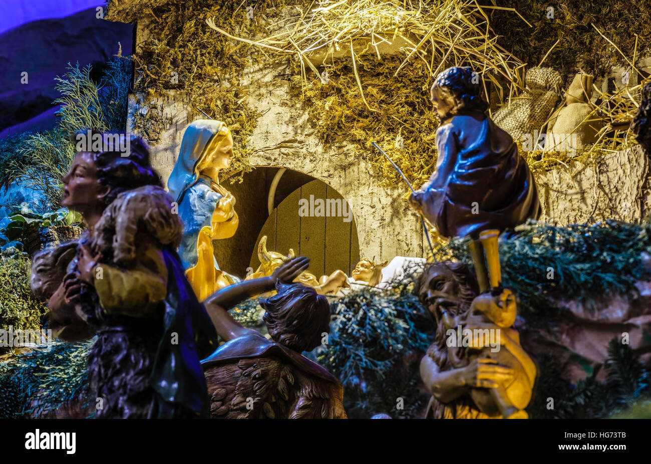 shepherds with sheep coming to adore Baby Jesus in a Christmas Nativity ...