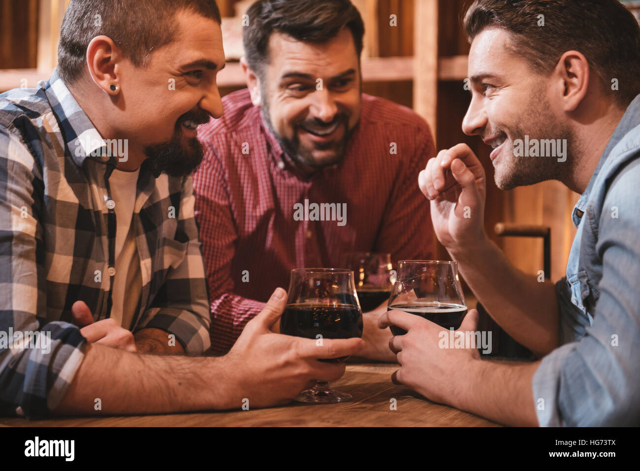 Joyful smiling man telling an interesting story Stock Photo - Alamy