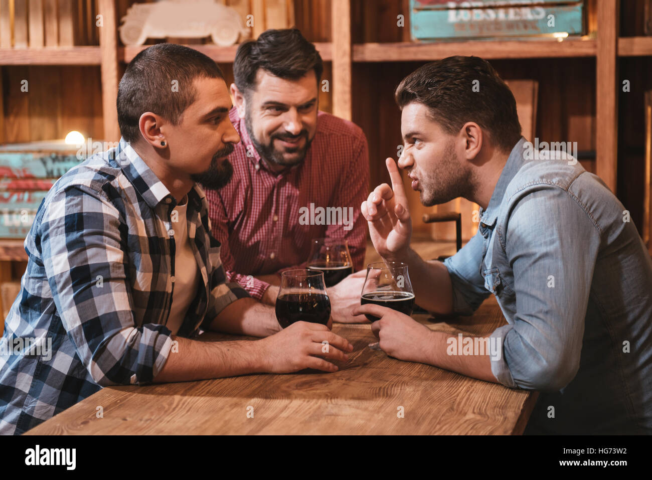 Telling a story at a party hi-res stock photography and images - Alamy