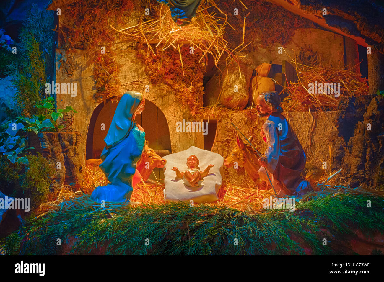 Christmas Nativity scene of baby Jesus in the manger with Saint Joseph ...