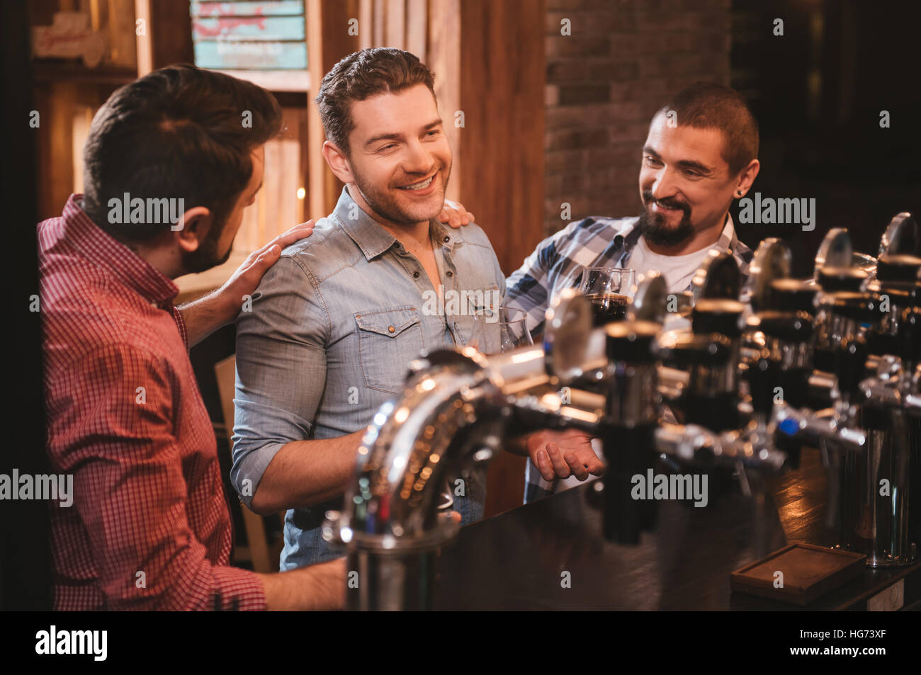 Positive handsome man enjoying their conversation Stock Photo - Alamy